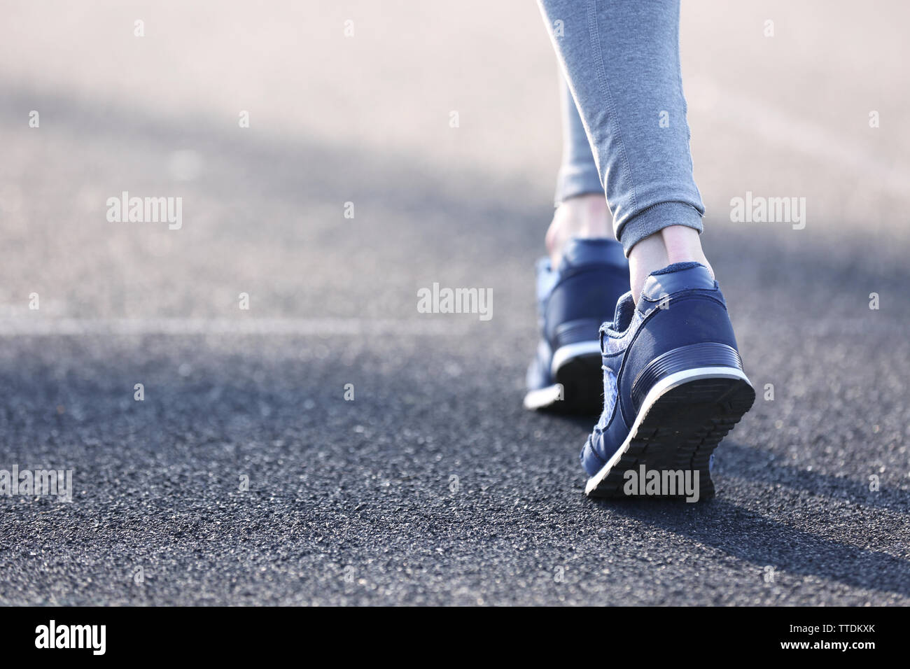 Sports woman legs in running movement Stock Photo - Alamy