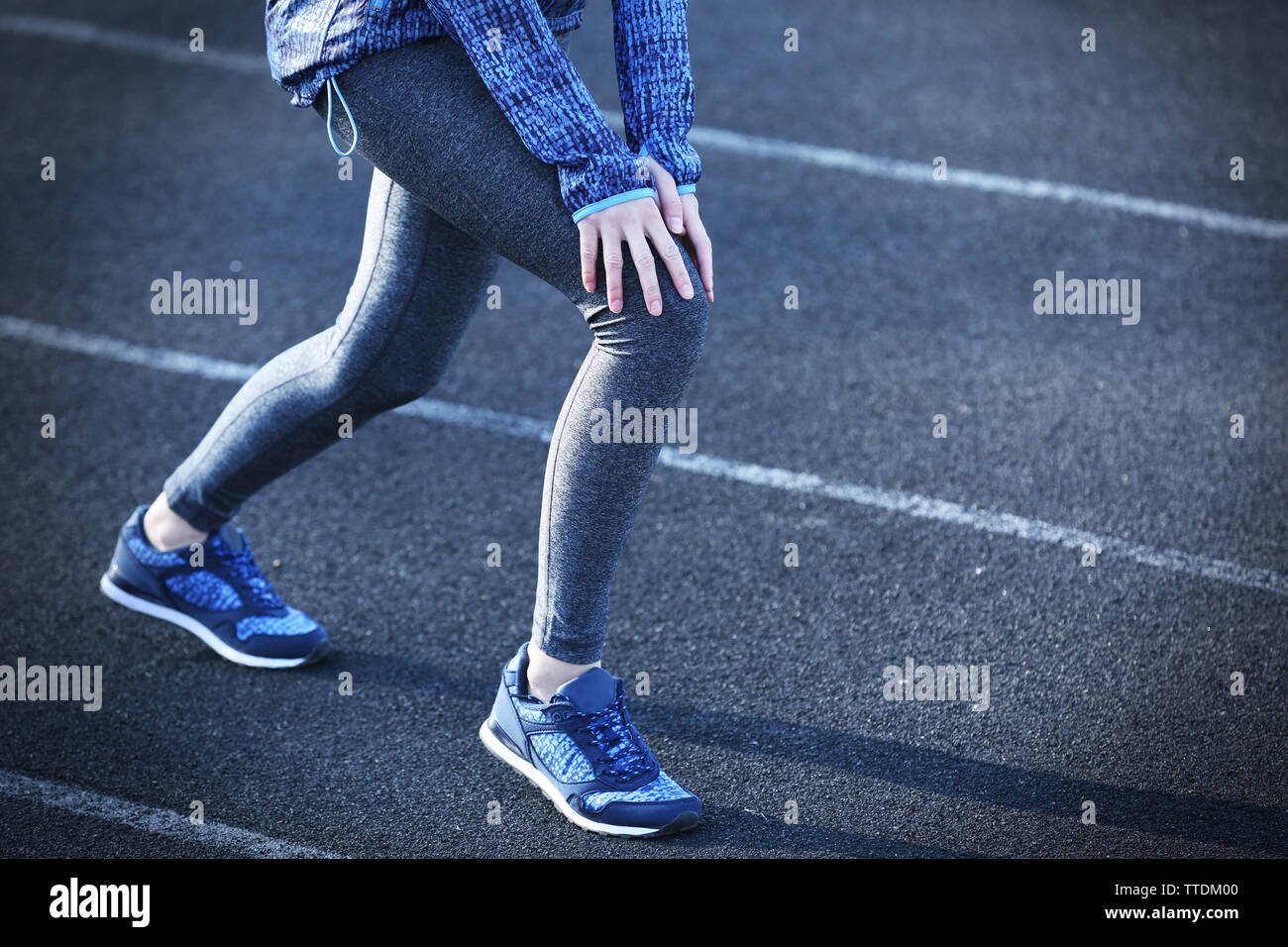 Sports woman legs in running movement Stock Photo - Alamy