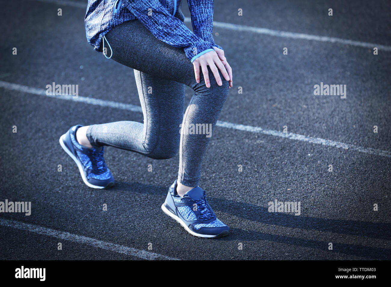 Sports woman legs in running movement Stock Photo - Alamy