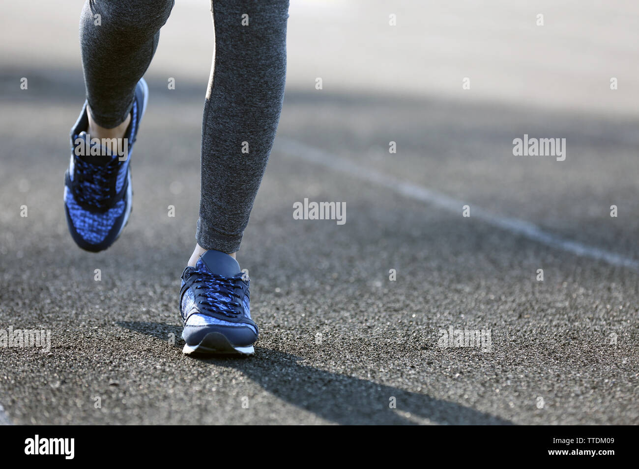 Female jogger walking in autumn hi-res stock photography and images - Alamy