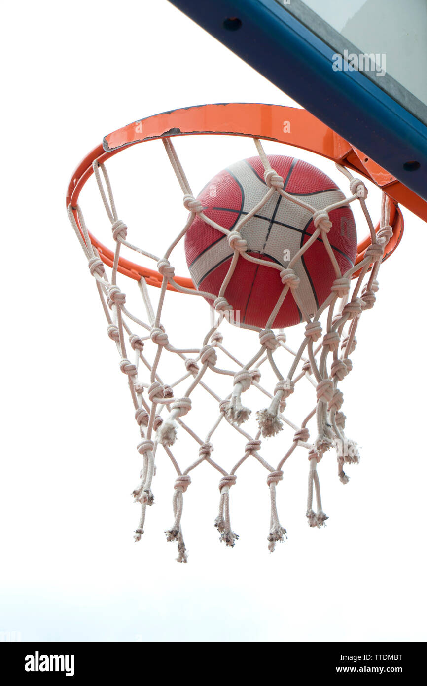 Basketball ball through hoop isolated hi-res stock photography and ...