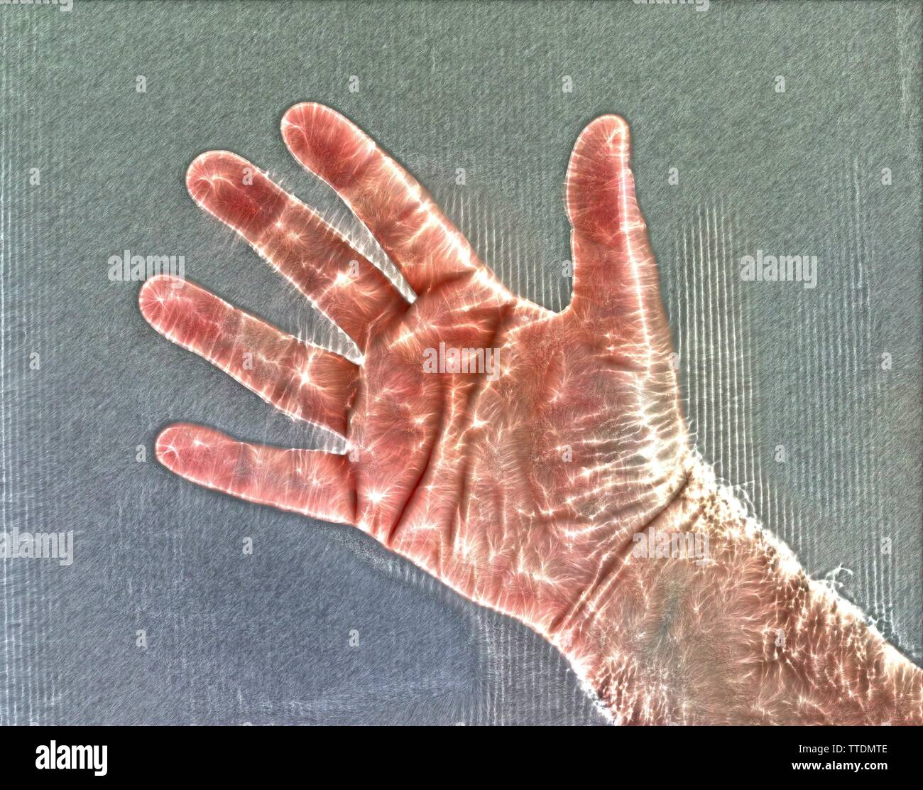 Kirlian aura photography of a glowing human male hand showing different ...