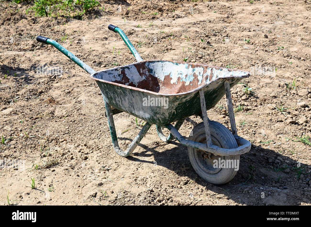 Wheelbarrow for housekeeping and construction work,on site Stock Photo ...