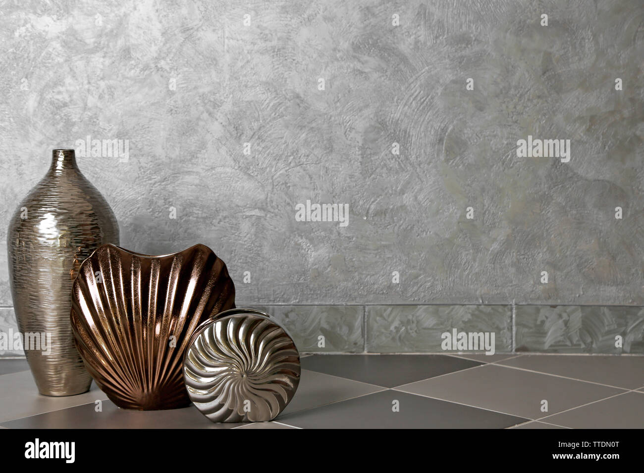 Home decor on grey wall background Stock Photo - Alamy