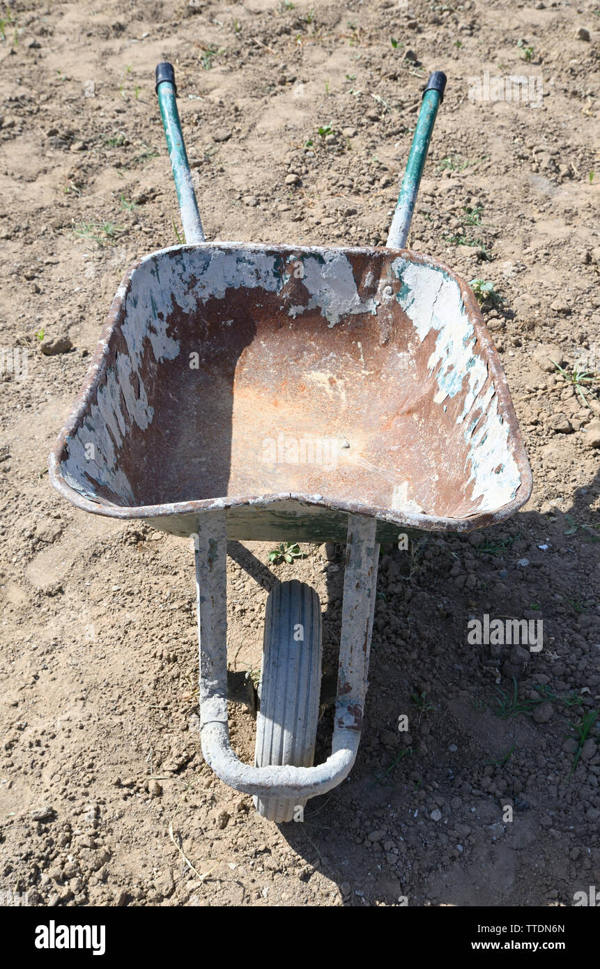 Wheelbarrow for housekeeping and construction work,on site.Cart.Trolley ...