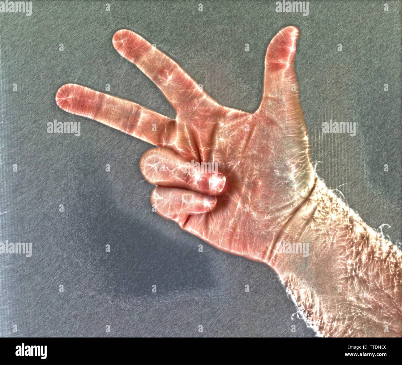 Kirlian aura photography of a glowing human male hand showing different ...