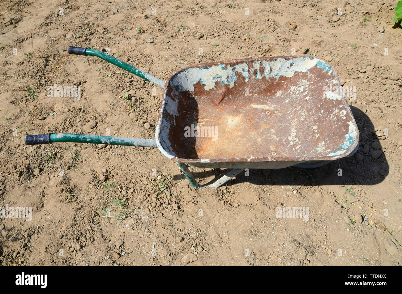 Wheelbarrow for housekeeping and construction work,on site.Cart.Trolley ...