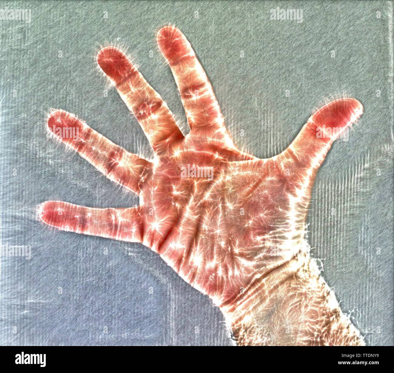 Kirlian aura photography of a glowing human male hand showing different ...