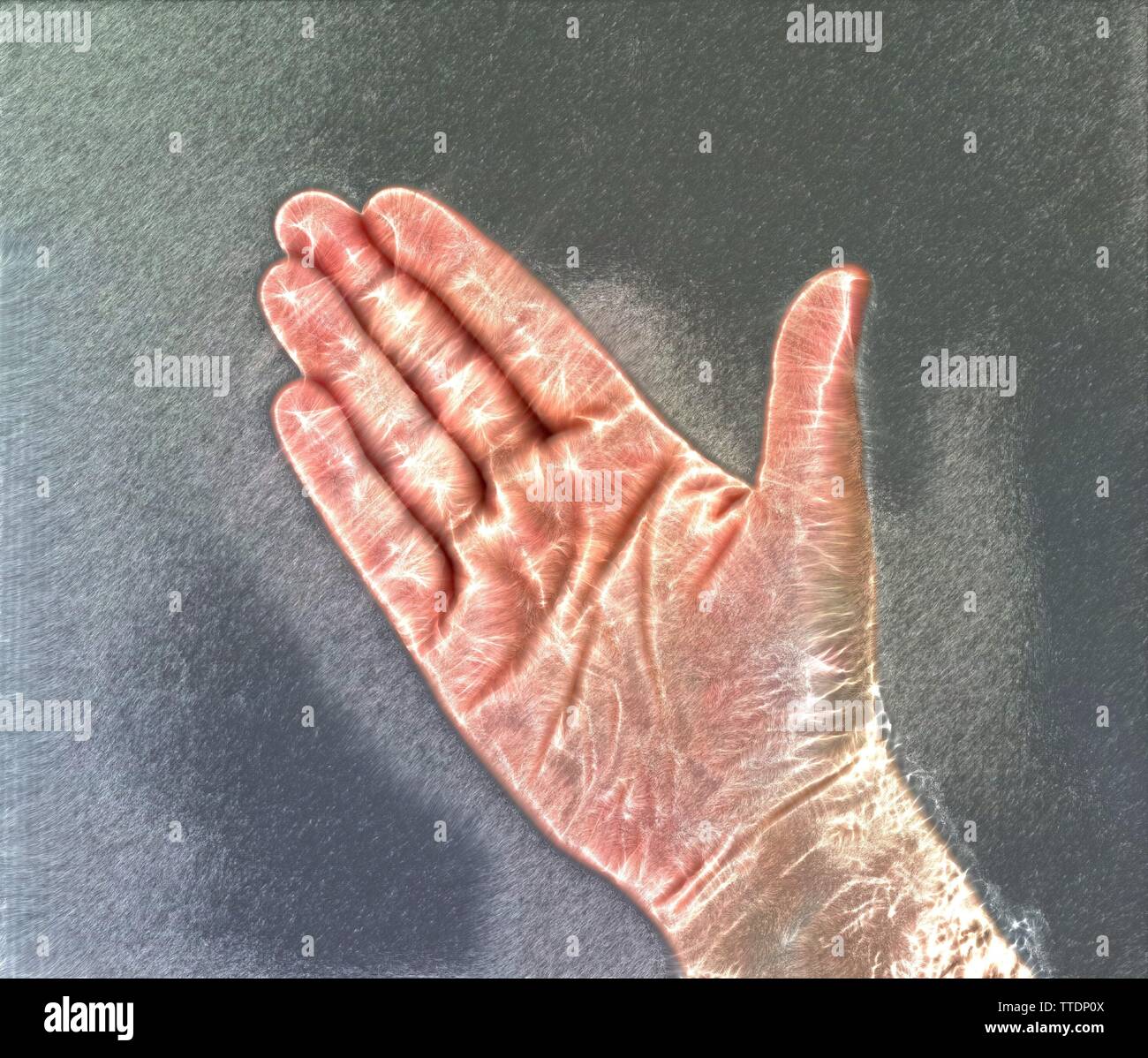 Kirlian aura photography of a glowing human male hand showing different ...