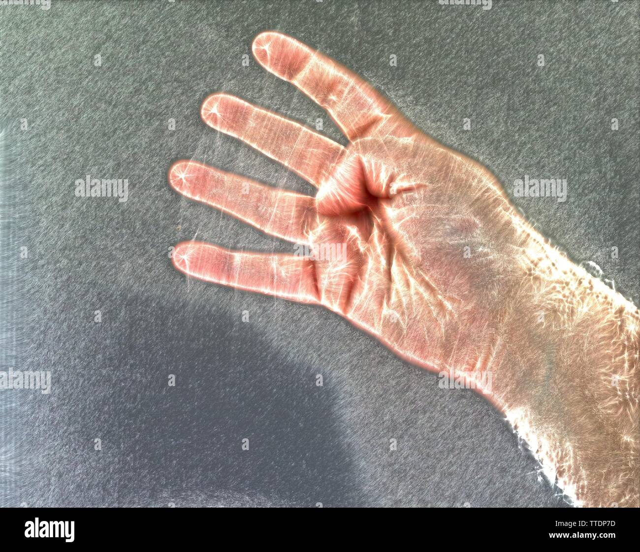Kirlian aura photography of a glowing human male hand showing different ...