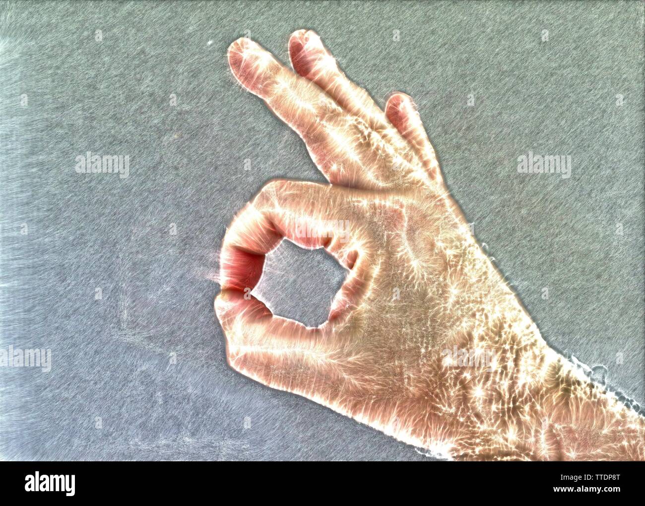 Kirlian aura photography of a glowing human male hand showing different ...