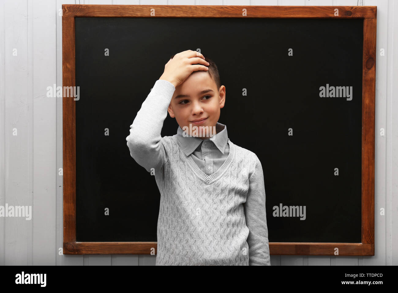 Young cute schoolboy posing at the blackboard Stock Photo - Alamy