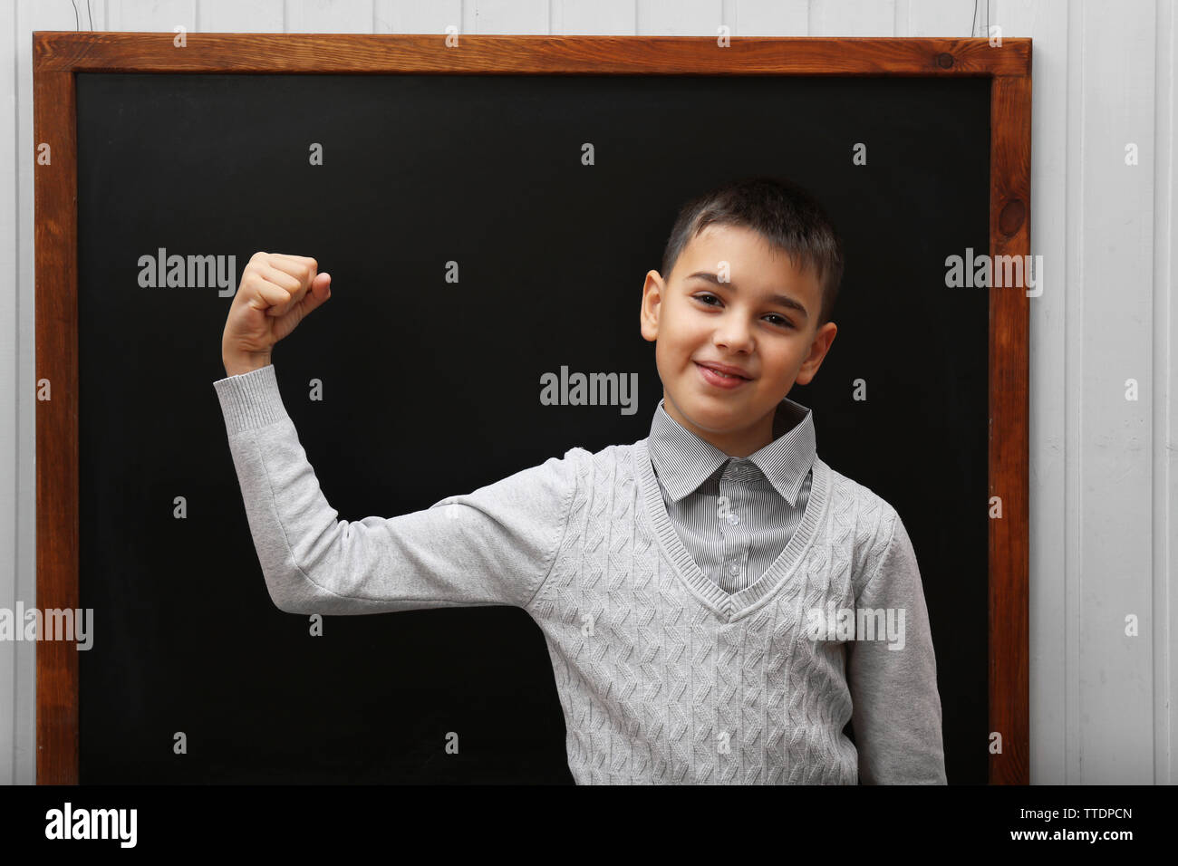 Young cute schoolboy posing at the blackboard Stock Photo - Alamy