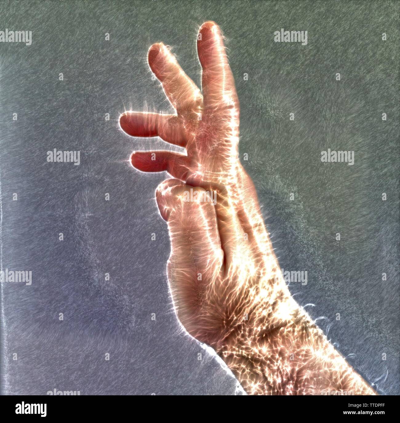 Kirlian aura photography of a glowing human male hand showing different ...