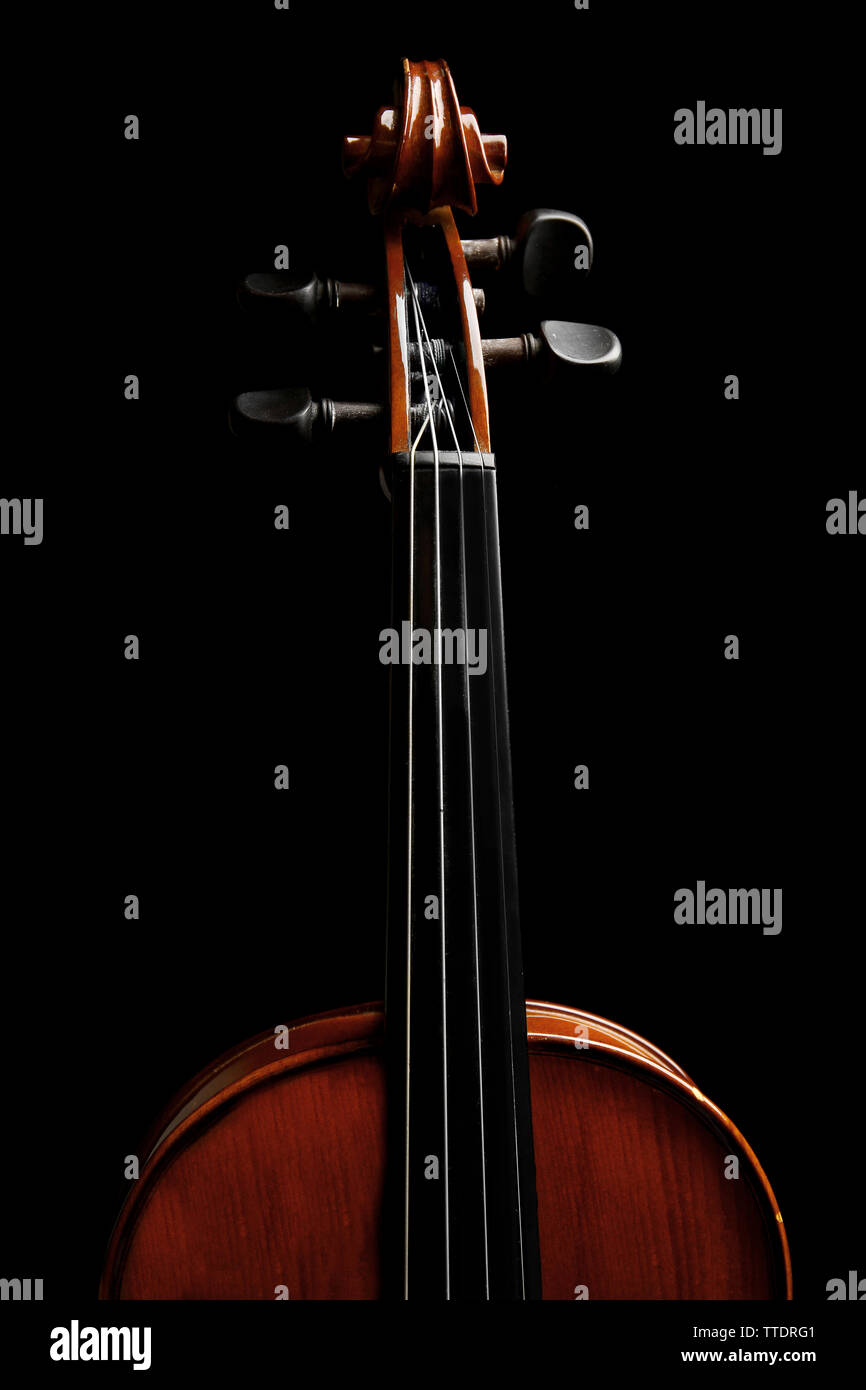 Violin neck on dark background Stock Photo - Alamy