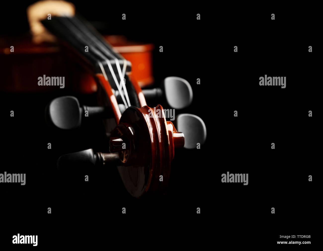 Violin neck on dark background Stock Photo - Alamy