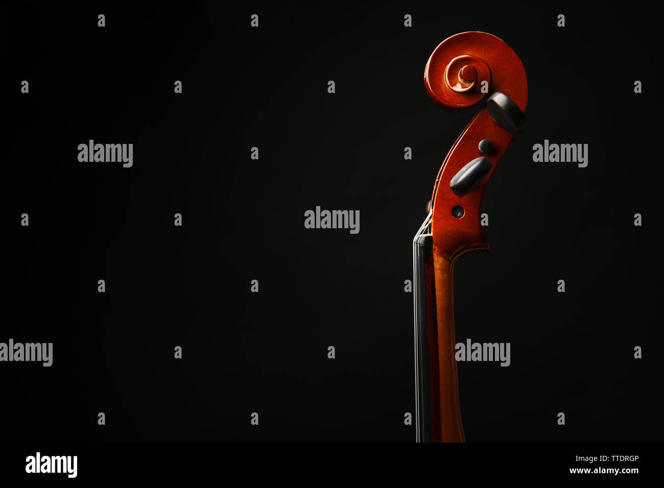 Violin neck on dark background Stock Photo - Alamy