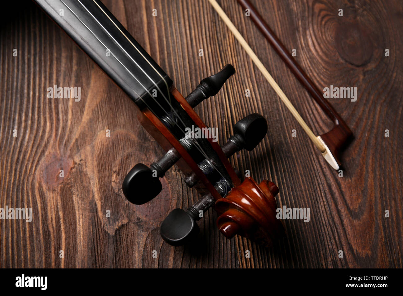 Violin neck on wooden background Stock Photo - Alamy