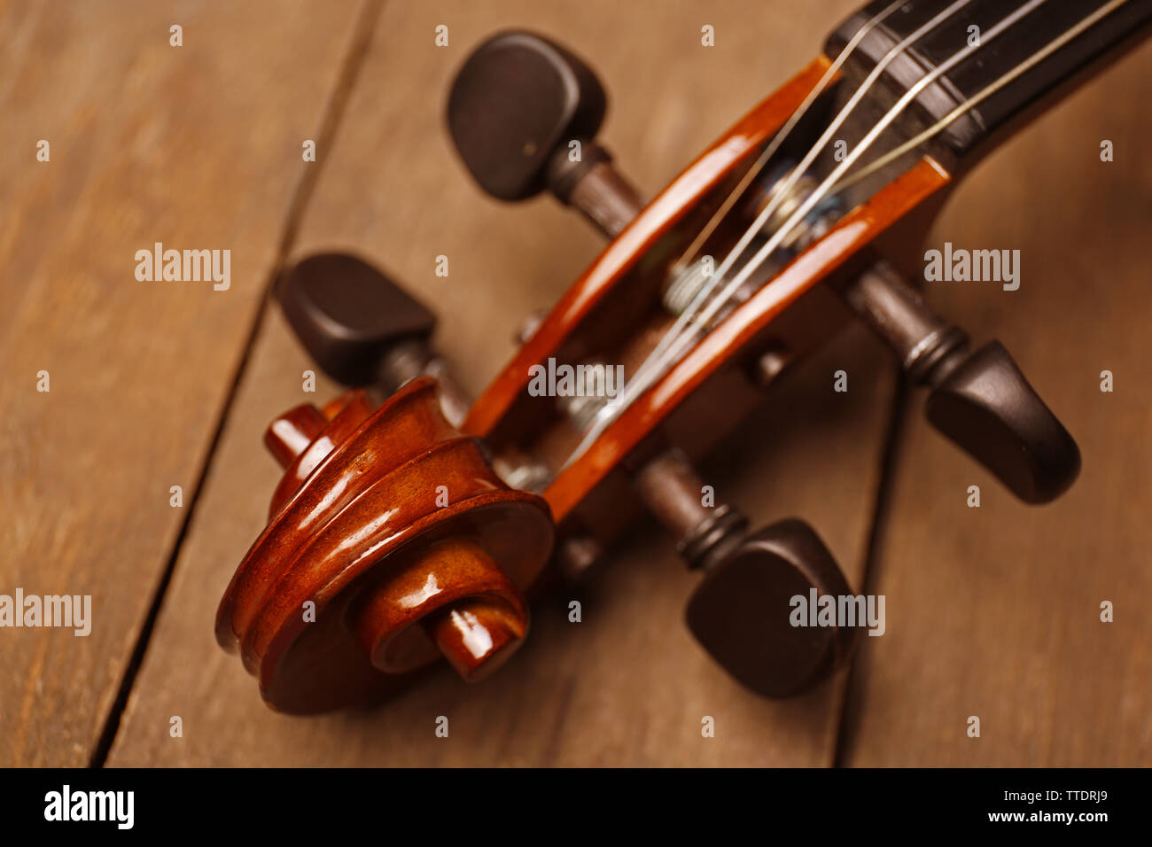 Violin neck on wooden background Stock Photo - Alamy