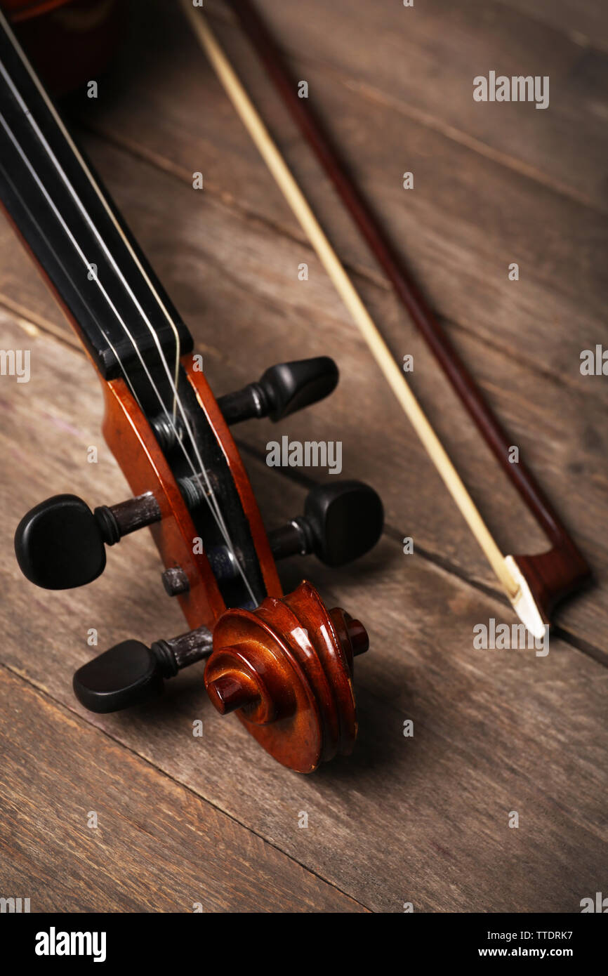 Violin neck on wooden background Stock Photo - Alamy