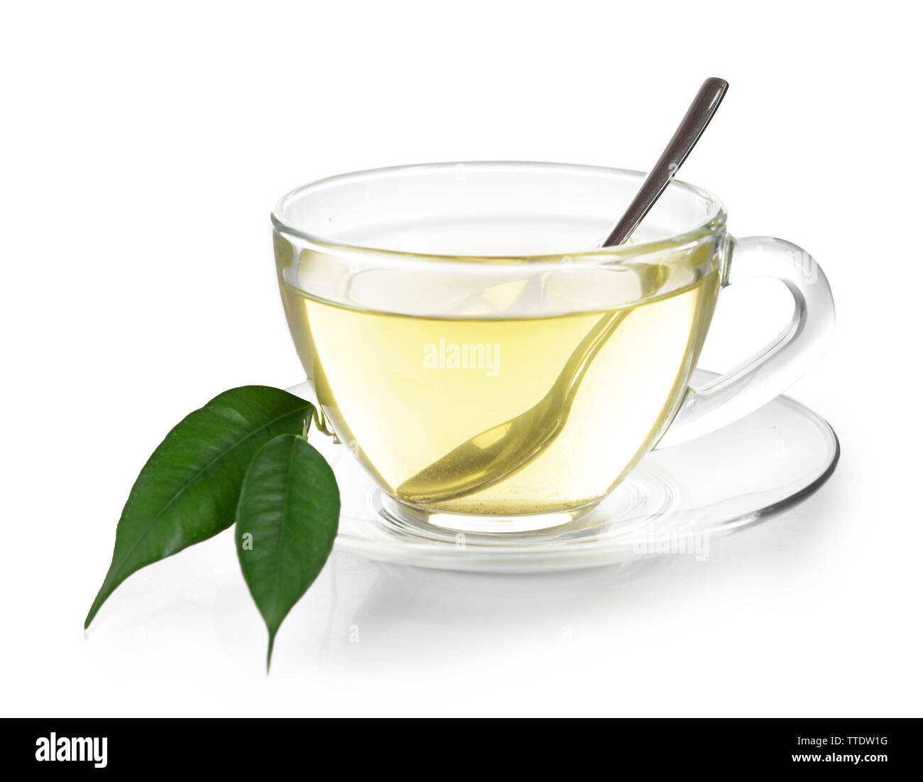Glass cup of tea with green leaves isolated on white background Stock ...