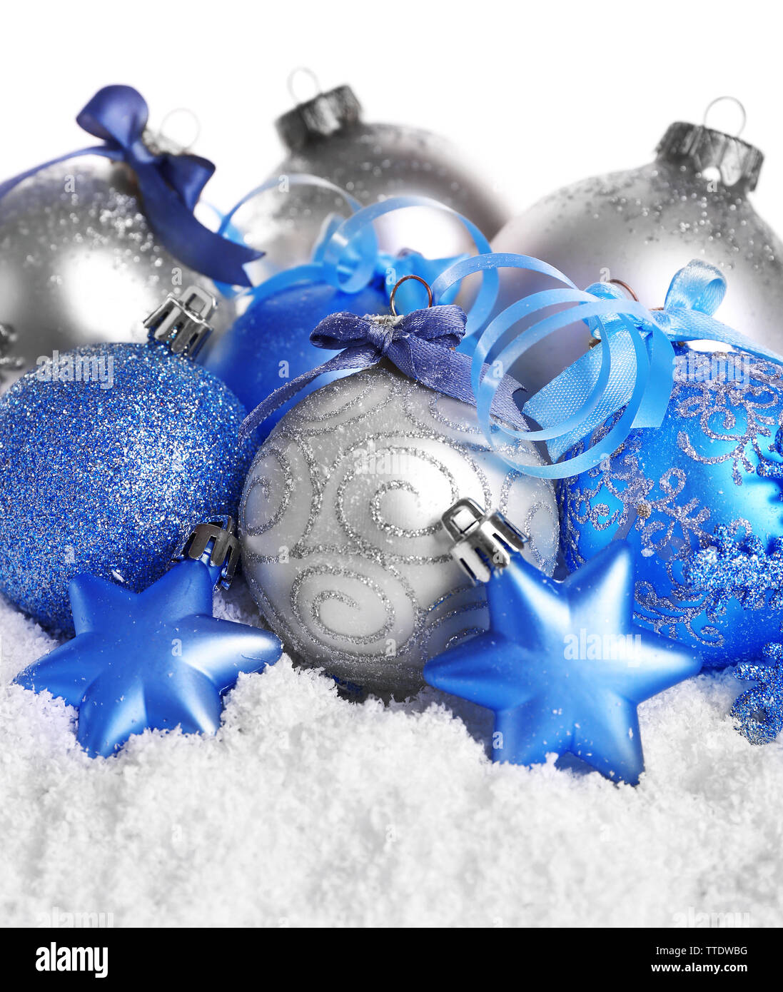 Christmas balls on snow with white background Stock Photo - Alamy