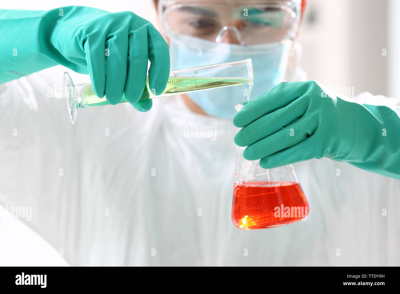 Man in laboratory checking test tubes Stock Photo - Alamy