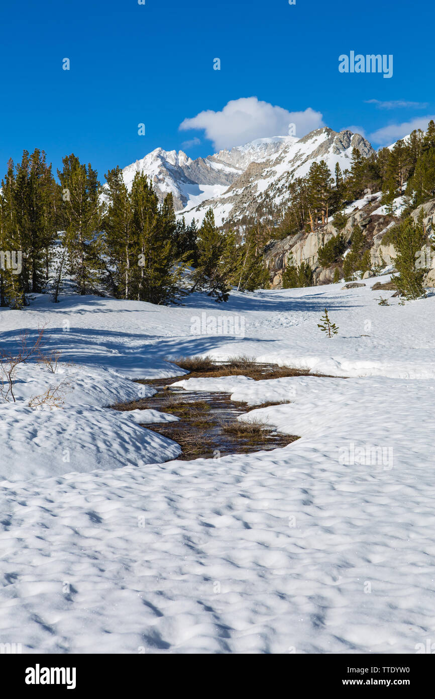 Snow capped mountain peaks in Spring at Little lakes valley the Eastern ...