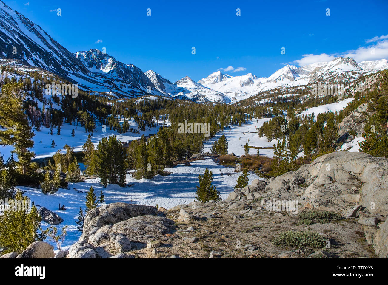 Snow capped mountain peaks in Spring at Little lakes valley the Eastern ...