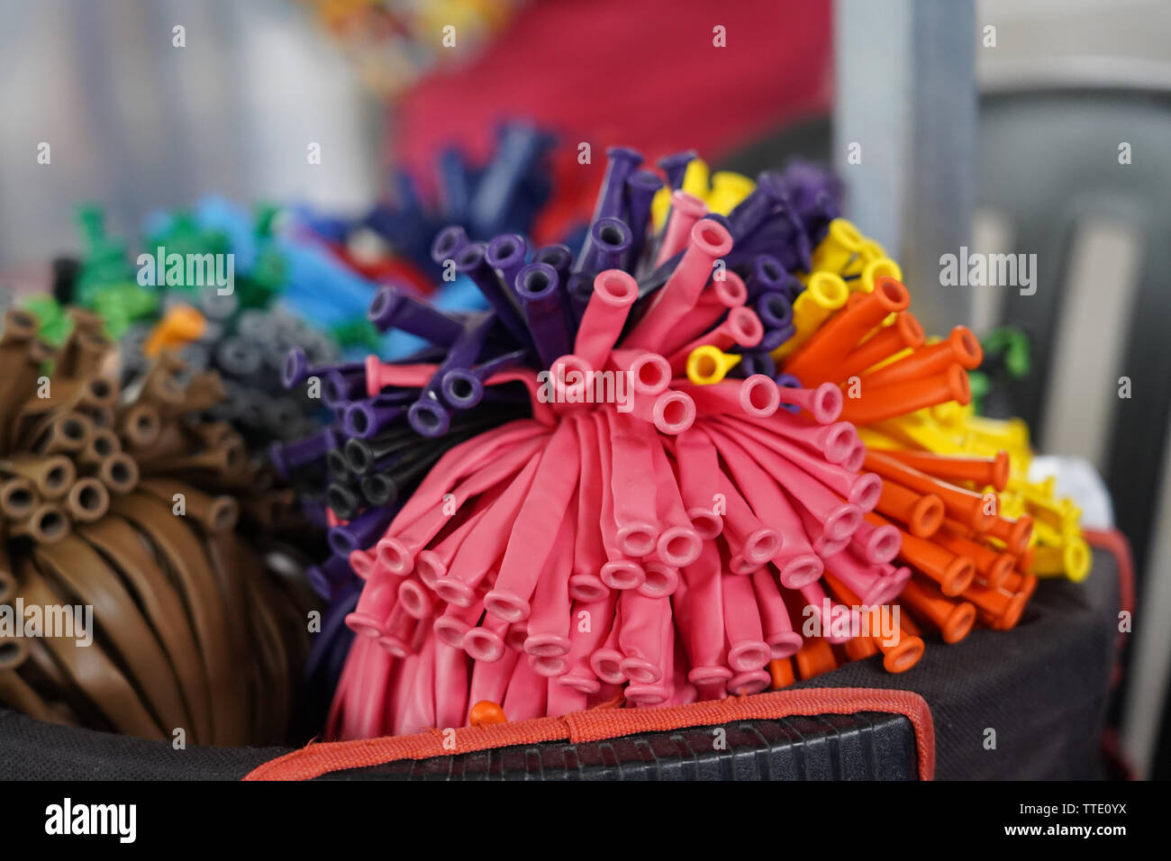 bright colourful deflated long balloons Stock Photo - Alamy