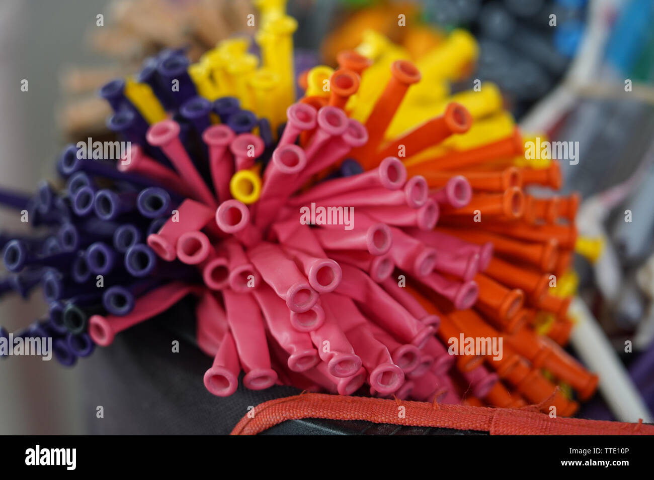bright colourful deflated long balloons Stock Photo - Alamy