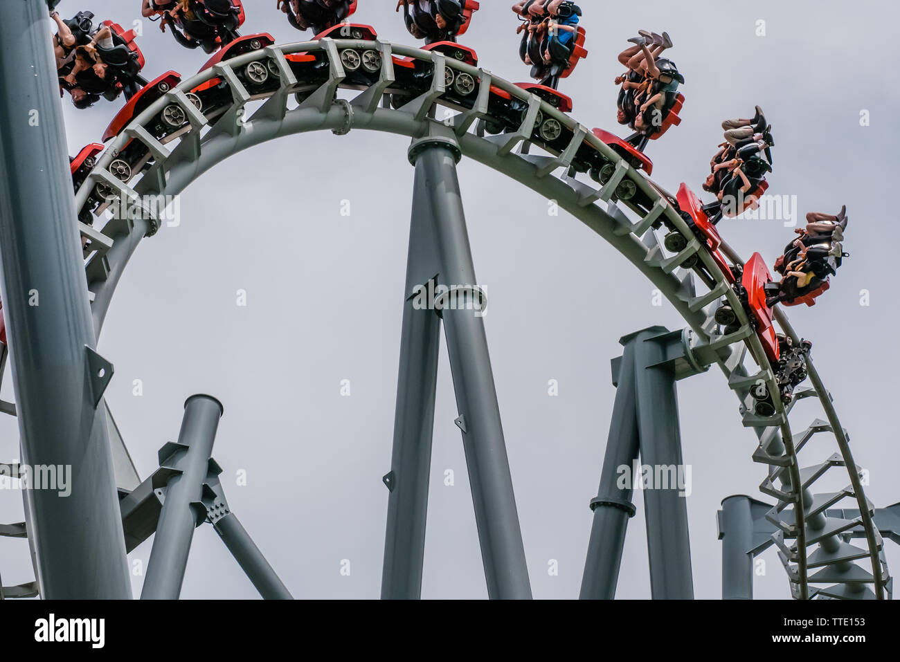 roller coaster ride inside amusement park on an overcast day Stock ...