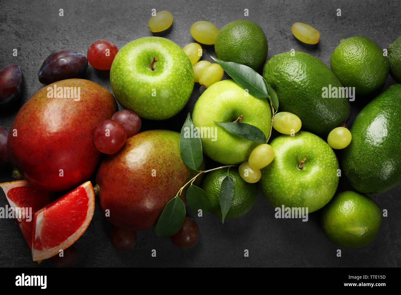 Fruits on dark grey background Stock Photo - Alamy