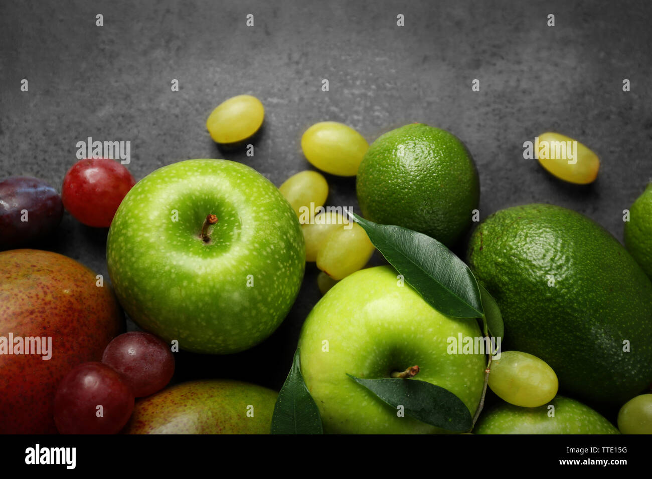 Fruits on dark grey background Stock Photo - Alamy