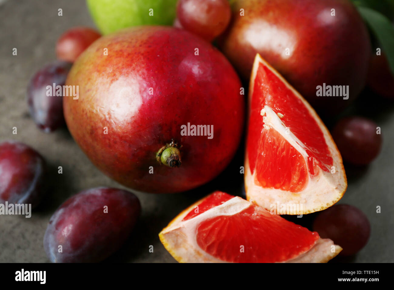 Fruits on dark grey background Stock Photo - Alamy