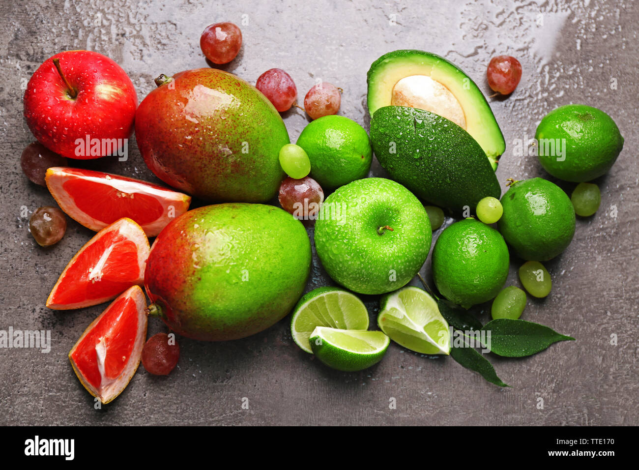 Fruits on grey background Stock Photo - Alamy