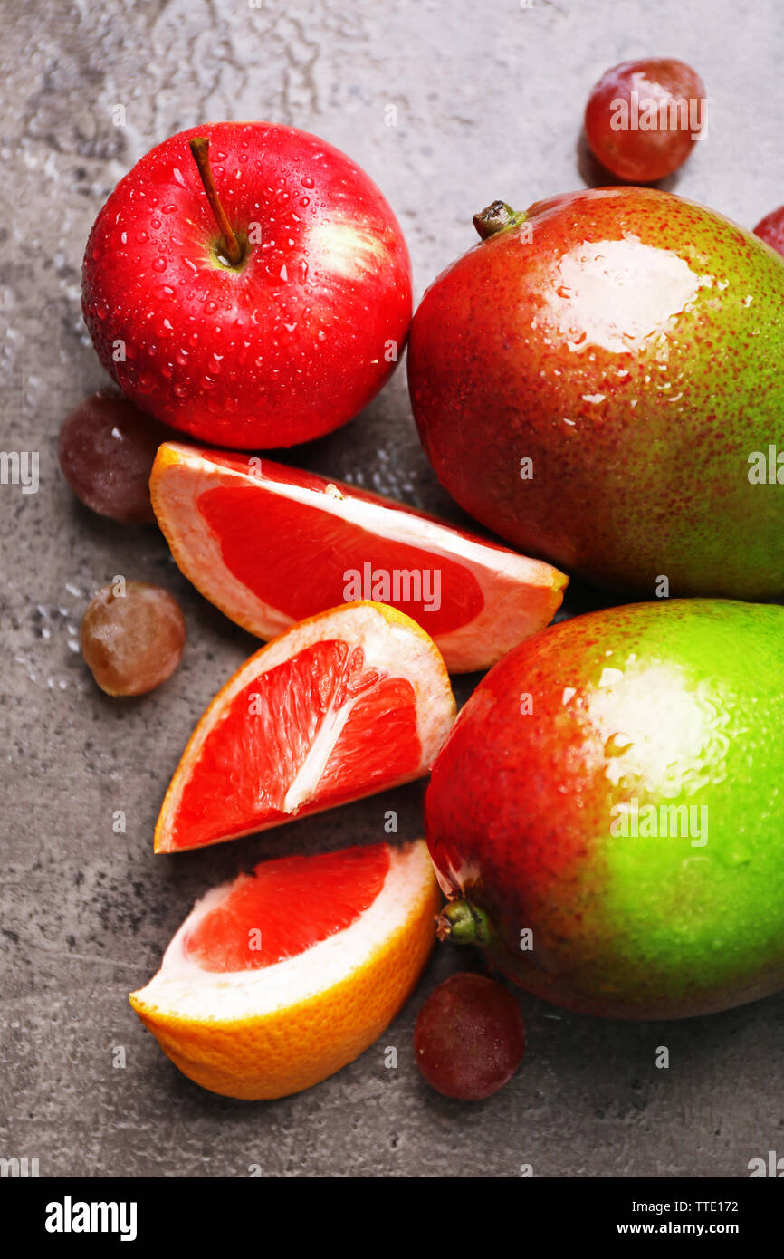 Fruits on grey background Stock Photo - Alamy