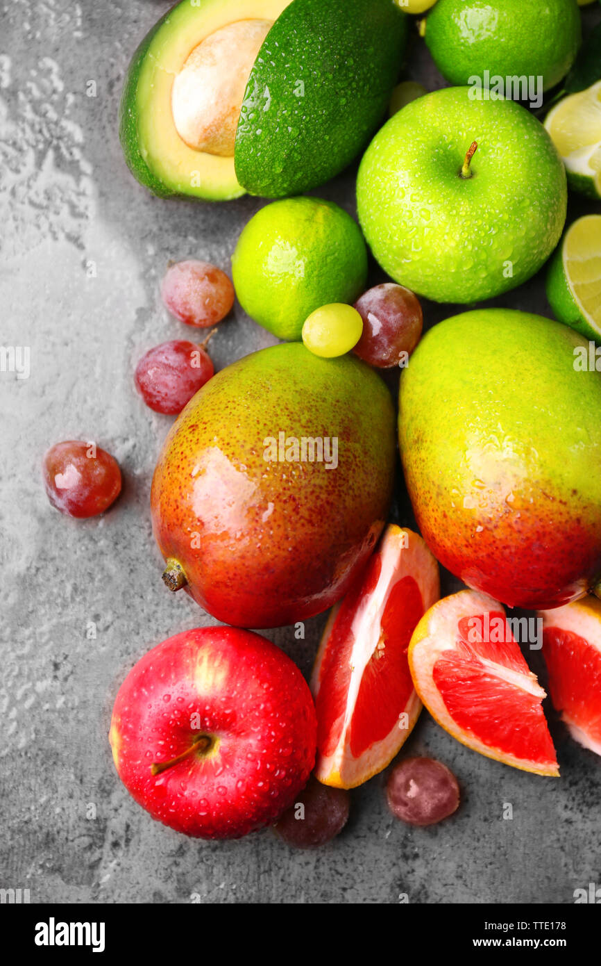 Fruits on grey background Stock Photo - Alamy