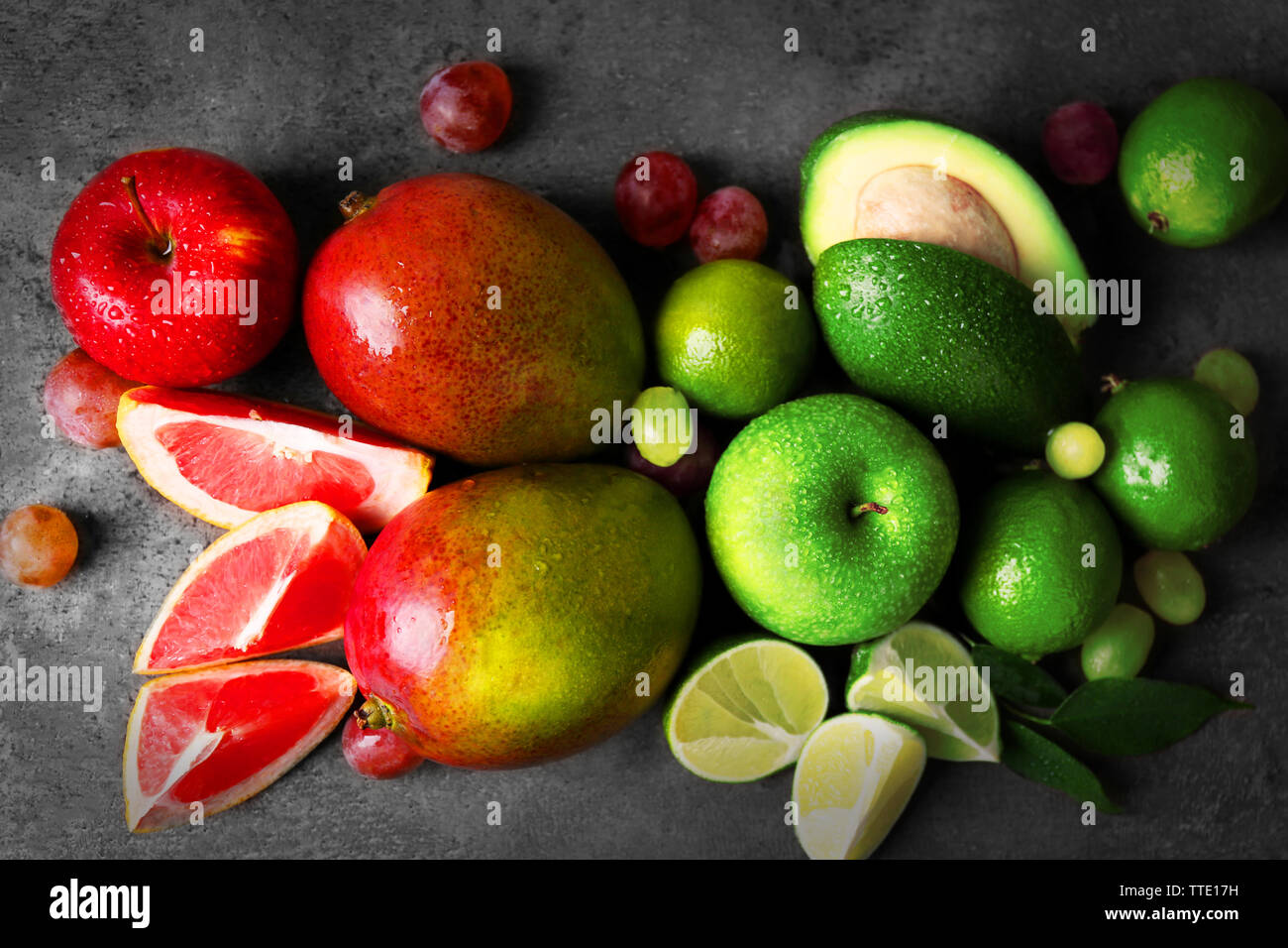 Fruits on grey background Stock Photo - Alamy