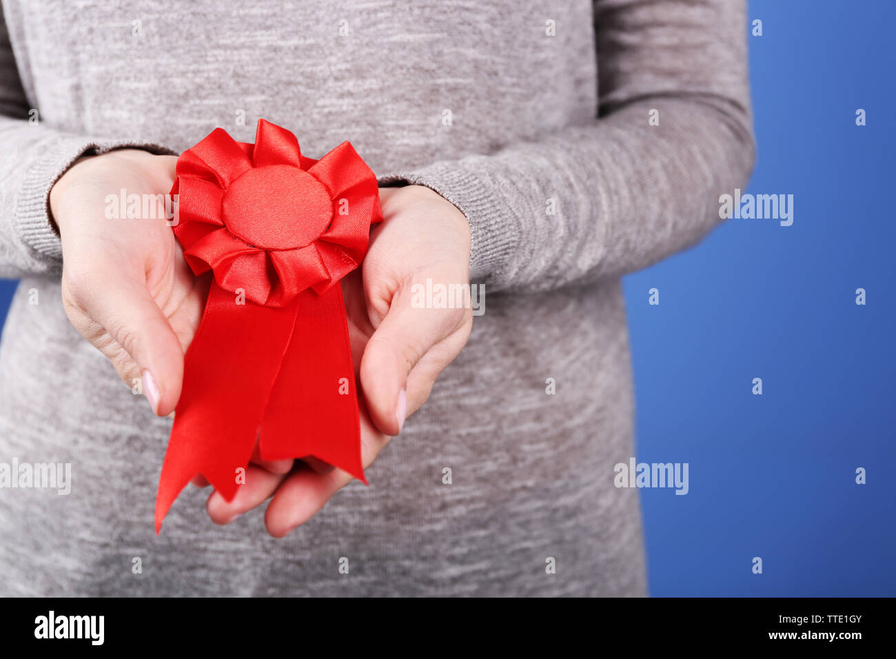 Woman with award ribbon. close-up Stock Photo - Alamy