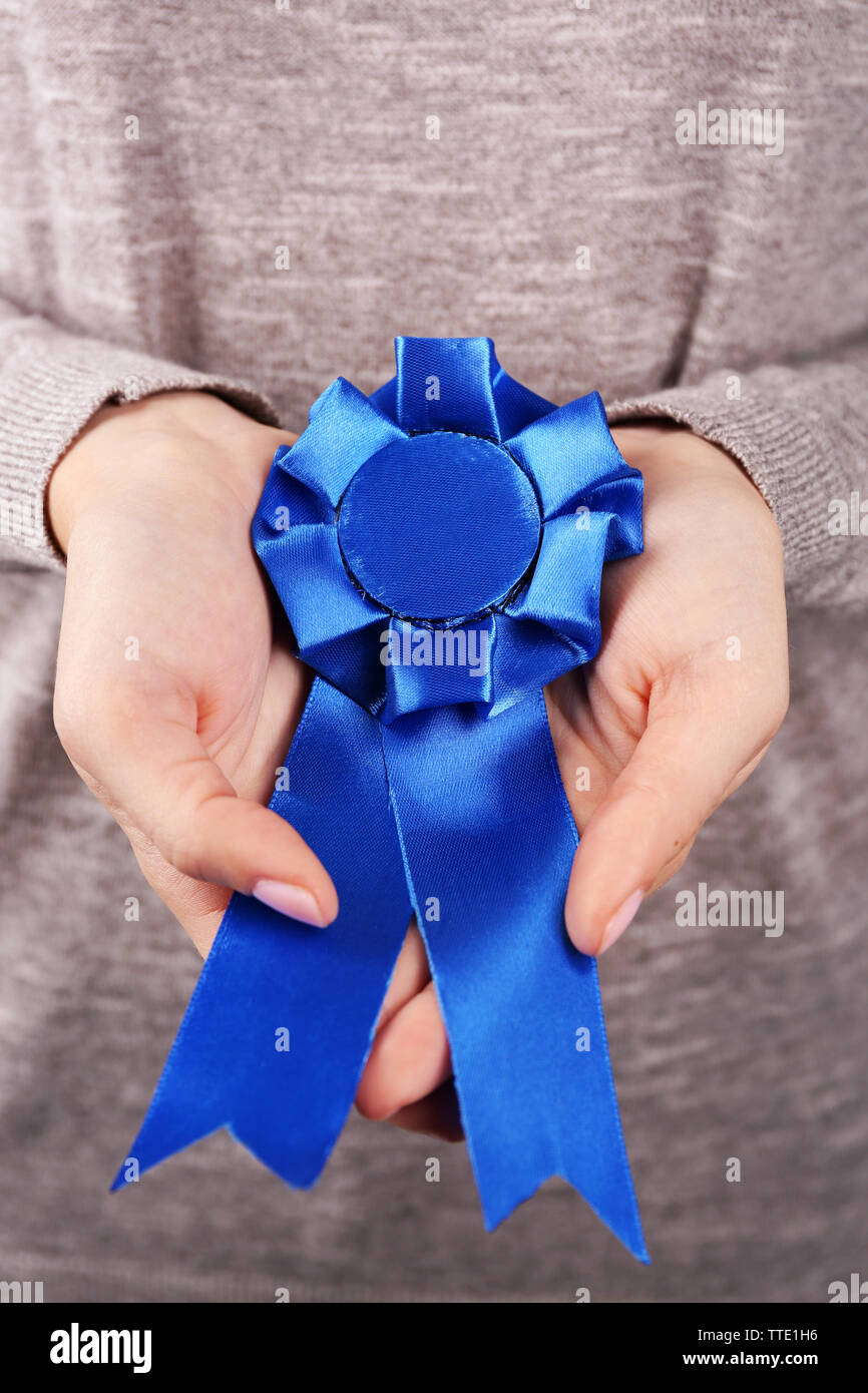 Woman with award ribbon. close-up Stock Photo - Alamy