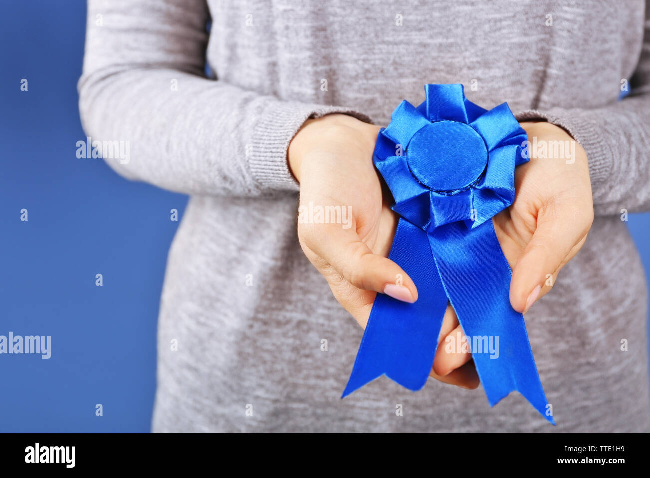 Woman with award ribbon. close-up Stock Photo - Alamy