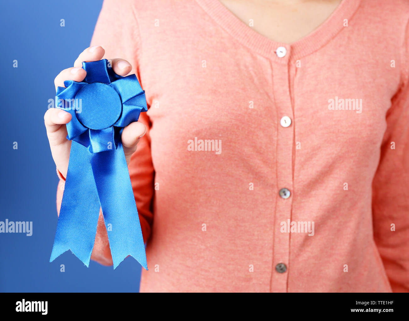 Woman with award ribbon. close-up Stock Photo - Alamy