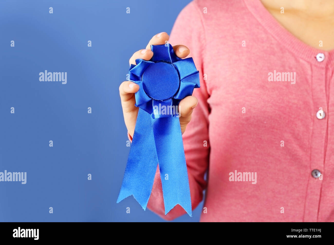 Woman with award ribbon. close-up Stock Photo - Alamy