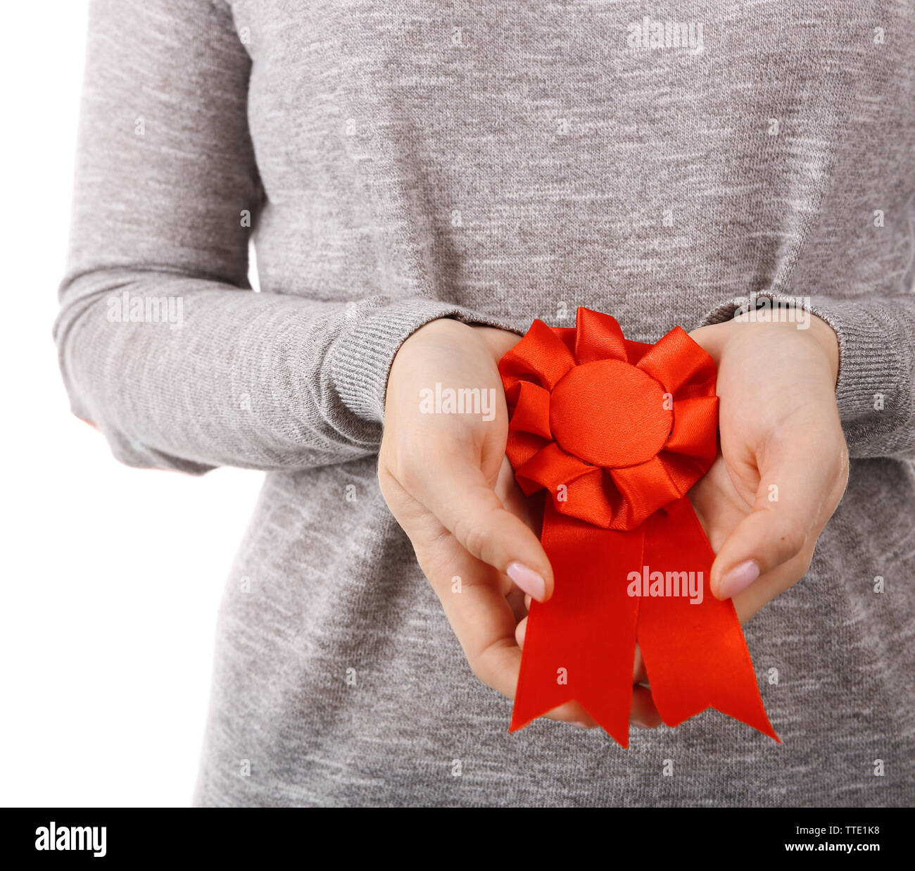 Woman with award ribbon, close-up, isolated on white Stock Photo - Alamy