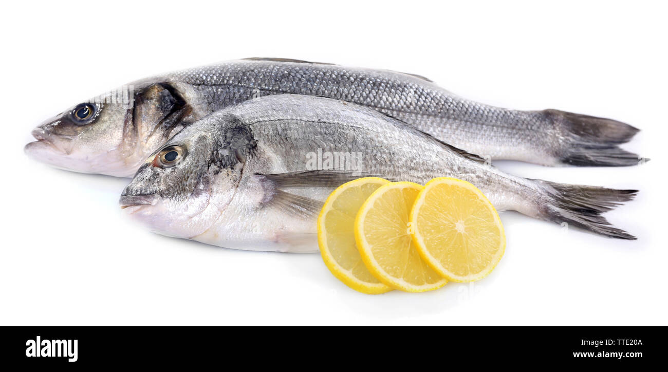 Fresh fish with lemon isolated on white background Stock Photo - Alamy