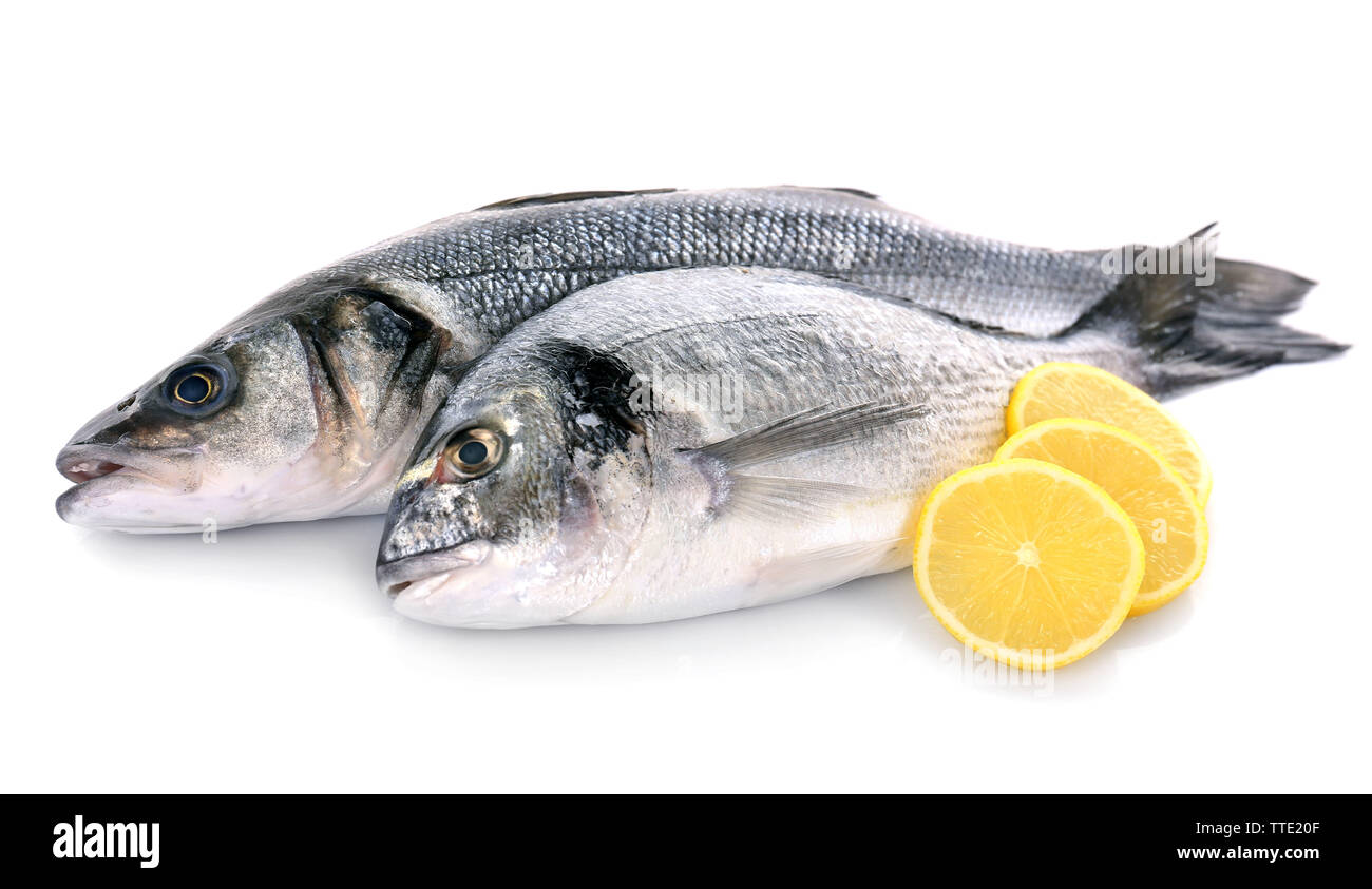 Fresh fish with lemon isolated on white background Stock Photo - Alamy