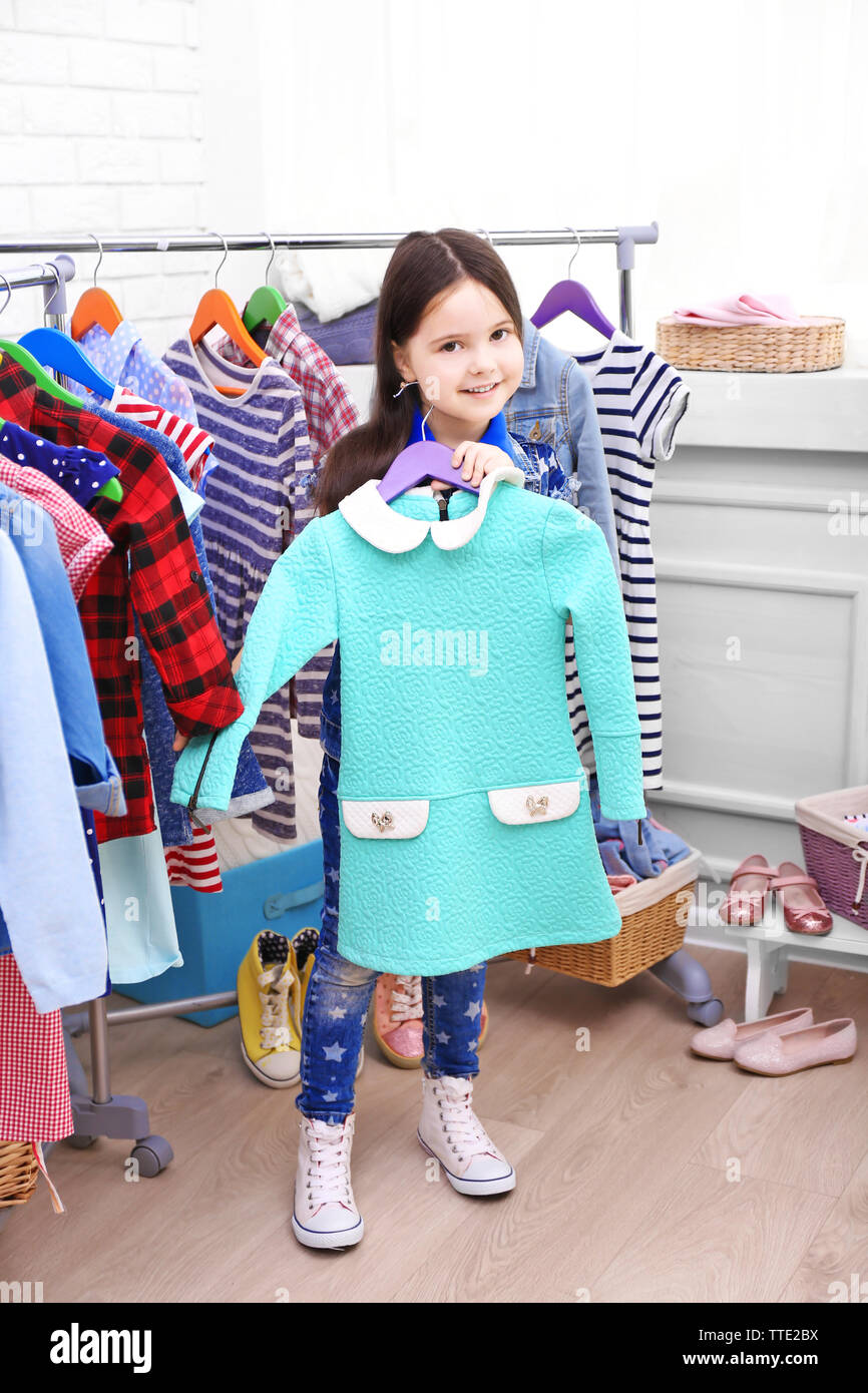 Child girl trying on new clothes hi-res stock photography and images ...