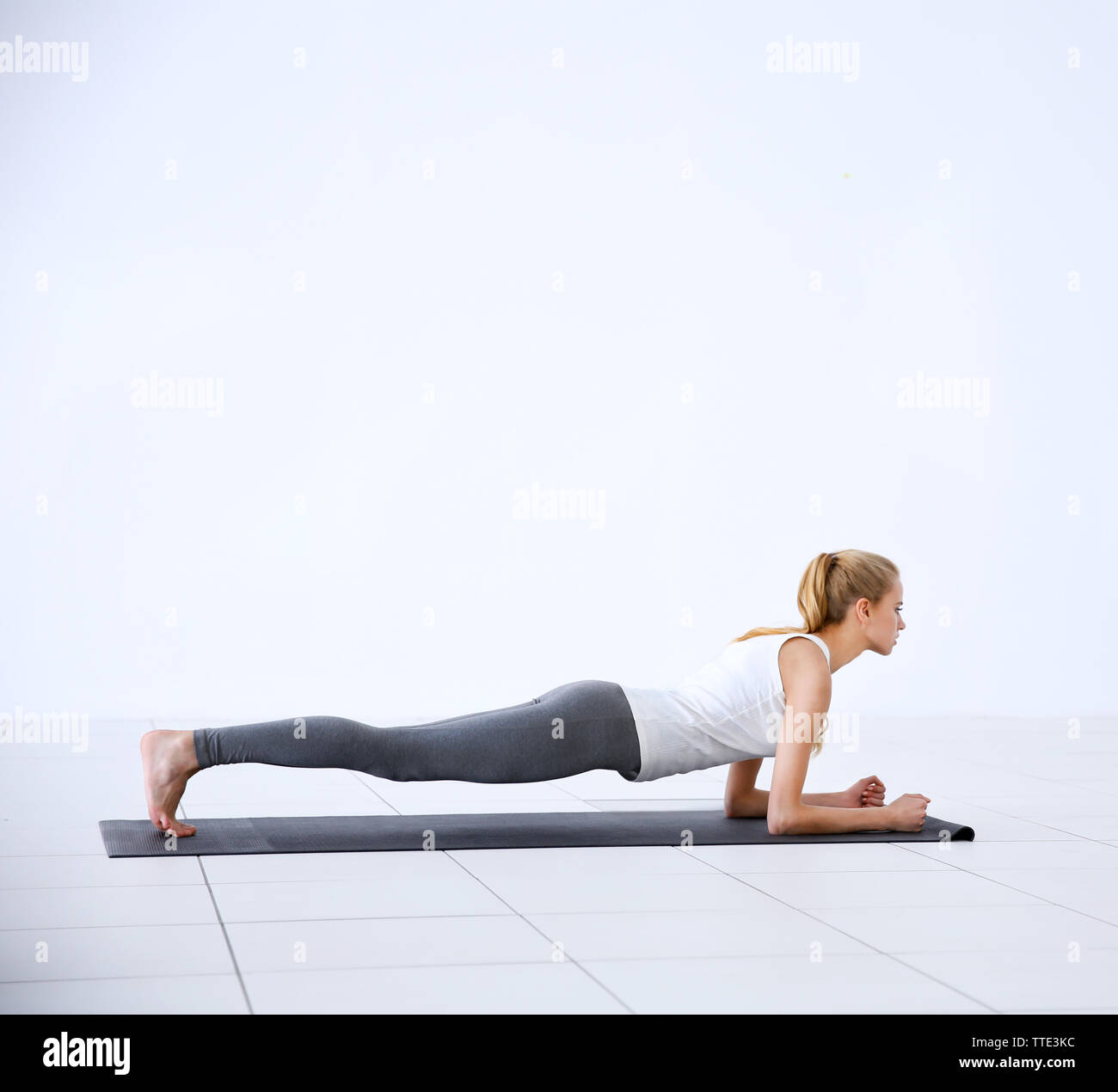 Young woman do yoga exercises Stock Photo - Alamy