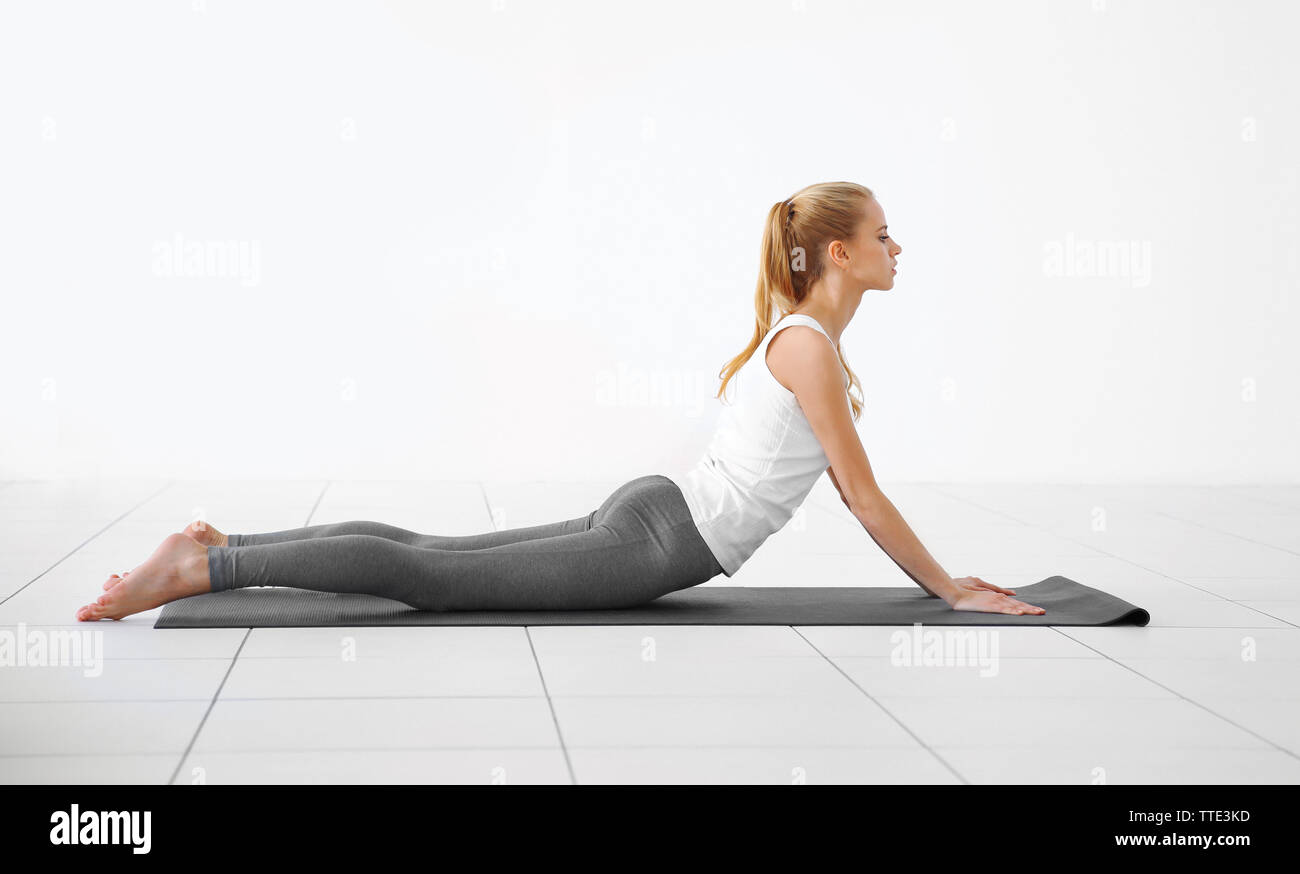 Young woman do yoga exercises Stock Photo - Alamy